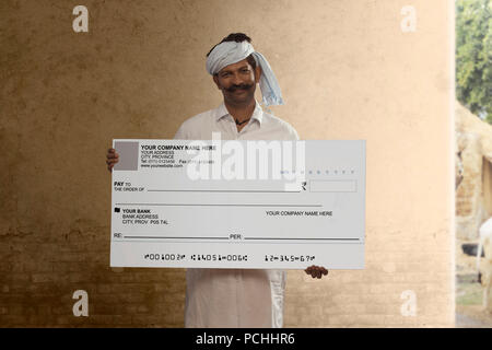 Portrait of Indian farmer showing a bank cheque Stock Photo - Alamy