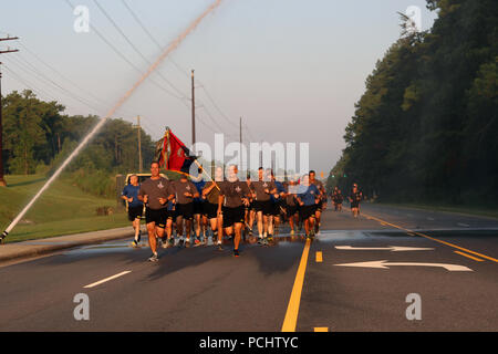 Command Sgt. Maj. Michael Ferrusi (center), U.S. Army Alaska command ...