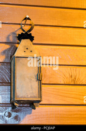 Old retro style lantern made of glassl in hand Stock Photo - Alamy