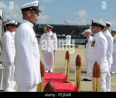 Capt. Carl Hartsfield, commander, Submarine Squadron Six, presents Cmdr ...