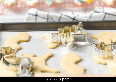 Unfinished unicorn shape sugar cookies on the baking sheet Stock Photo ...