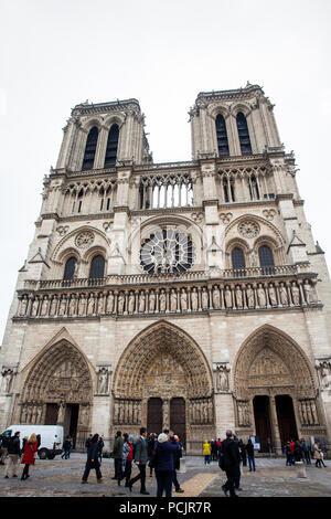 PARIS, FRANCE - MARCH, 2018: Lady with a red umbrella at the pink house ...