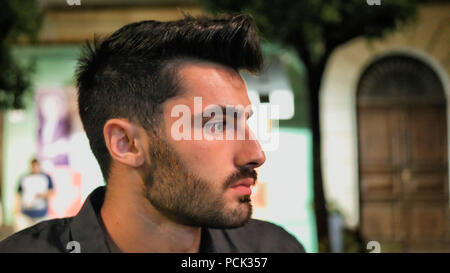 Young man outside at night Stock Photo - Alamy