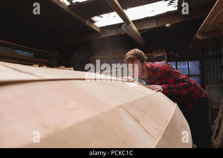 Young carpenter working at workshop Stock Photo - Alamy