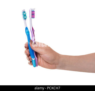 toothbrush or toothbrush in hand on background Stock Photo - Alamy