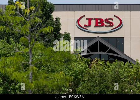 A logo sign outside of the headquarters of JBS USA Holdings, Inc., in ...
