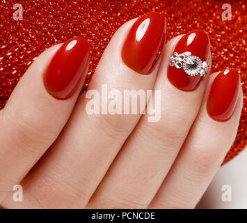 Bright festive red manicure Stock Photo - Alamy