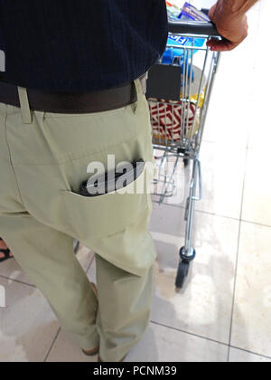 Man with wallet sticking out of back pocket Victoria Coach Station ...