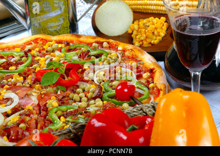 Pizza with corn, bacon, chili, onion, pea Stock Photo - Alamy