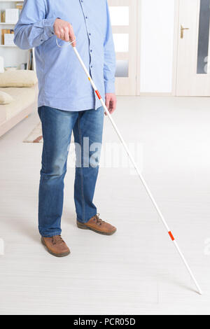 blind man with white stick and dark glasses at home Stock Photo - Alamy