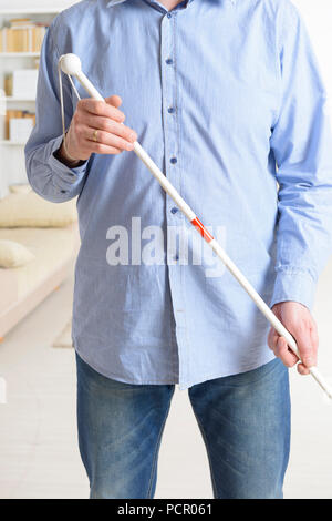 blind man with white stick at home Stock Photo - Alamy
