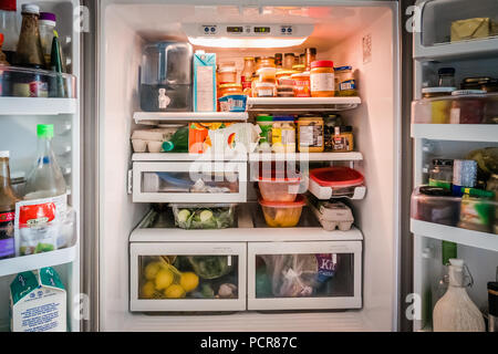 packed and filled up refrigerator Stock Photo - Alamy