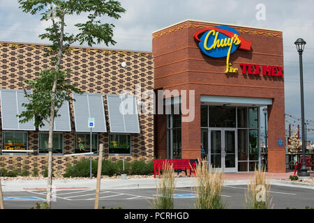 A logo sign outside of a Chuy's restaurant location in Westminster ...