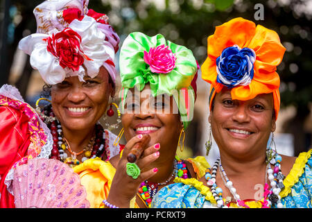 Three Cuban women in colorful Spanish-inspired costumes, Havana, Cuba ...