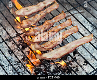 Bacon slices grilling on a Fire Stock Photo - Alamy