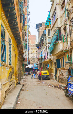 The modern houses in poor residential neighborhood with mosque between ...