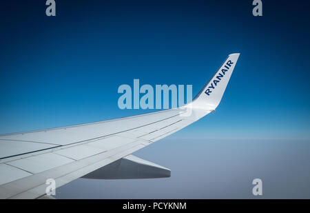 Wing of Ryanair plane during flight Stock Photo - Alamy