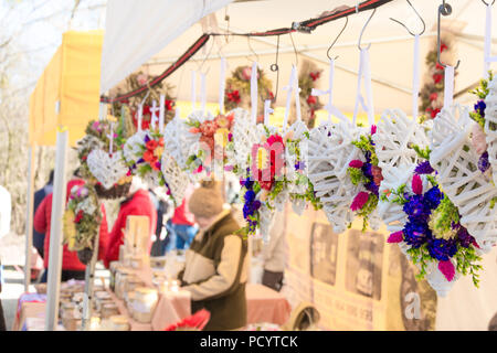 Colorful fair decorations. Handicraft toys made of straw and vines ...