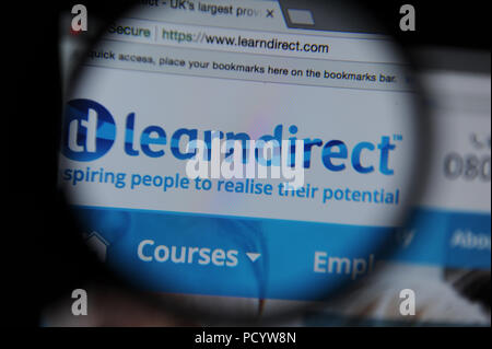 The Learndirect website seen through a magnifying glass Stock Photo - Alamy