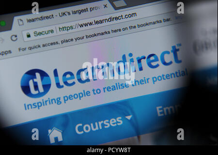 The Learndirect website seen through a magnifying glass Stock Photo - Alamy
