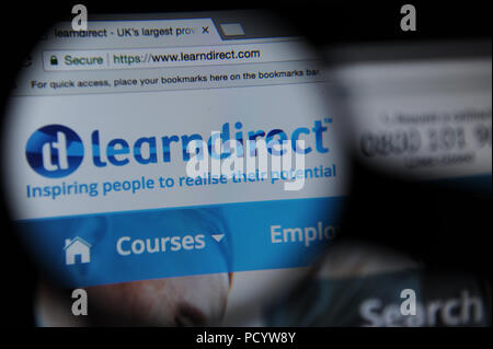 The Learndirect website seen through a magnifying glass Stock Photo - Alamy