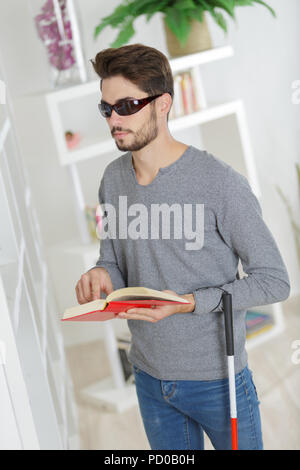 blind man with white stick at home Stock Photo - Alamy