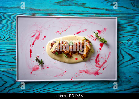 lamb gizzard recipe on a cream modern cuisine presentation Stock Photo ...