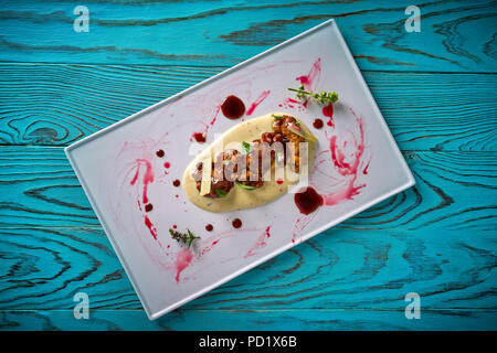 lamb gizzard recipe on a cream modern cuisine presentation Stock Photo ...