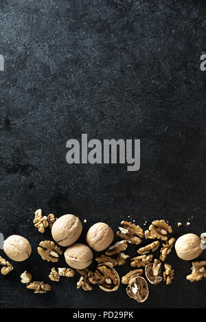 Closeup on walnut shells on stone substrate Stock Photo - Alamy