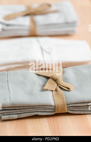 Stack of new linen dinner napkin on the kitchen counter Stock Photo - Alamy