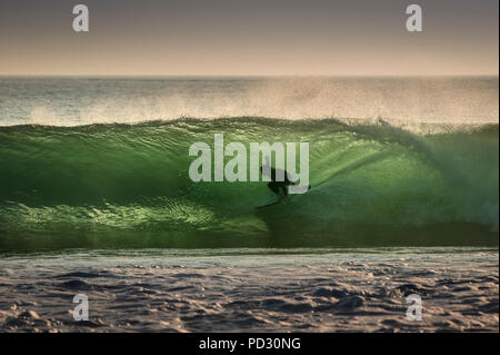 Surfer surfing on barreling wave, Crab Island, Doolin, Clare, Ireland ...