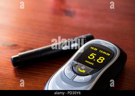 BG meter with lancing device on a kitchen table Stock Photo - Alamy
