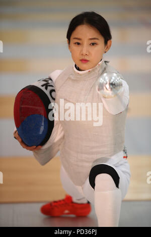 South Korea's Hyun Hee Nam, right, hugs Ha Na Oh after the women's foil ...