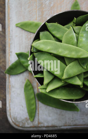 preparing mange tout beans Stock Photo - Alamy
