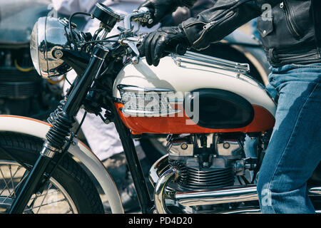 Biker on a Triumph motorcycle. Classic british motorcycle Stock Photo ...