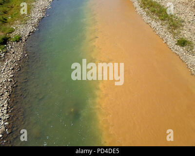 polluted river, half dirty, half clean Stock Photo - Alamy