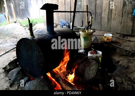 Woman drinks home made alcohol at Mursi tribe ethnic group coming of ...