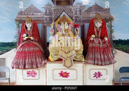 Colorful Hindu gods and goddesses by a small temple on Mallick Ghat in ...