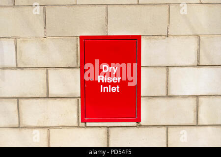 Dry riser red inlet box and sign at wall Stock Photo - Alamy