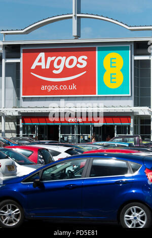 Argos and EE store sign logo Stock Photo - Alamy