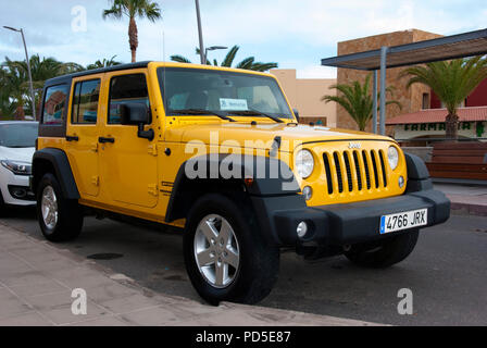 4 door yellow Jeep Wrangler Unlimited Rubicon Stock Photo - Alamy