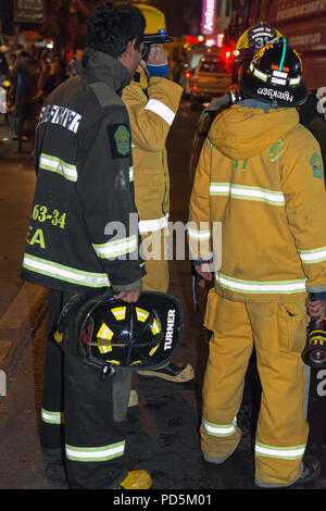Firemen in protective clothing wait to be deployed at the US consulate ...