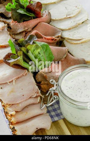 fresh sliced cold meat selection buffet table Stock Photo - Alamy