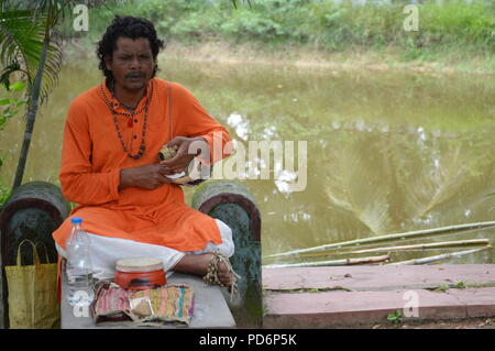 A Baul is performing Baul song at the Srijani Shilpagram compound ...