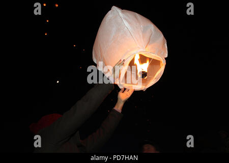 Sky lanterns floating in the sky. Deepavali lights festival. Chinese ...