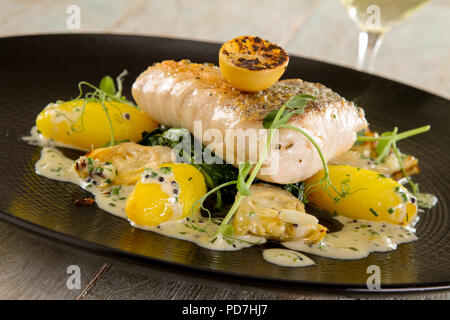 plated fish cod loin main meal Stock Photo - Alamy