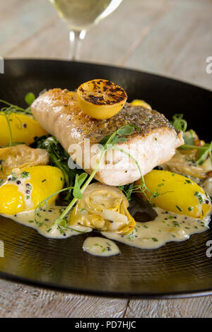 plated fish cod loin main meal Stock Photo - Alamy