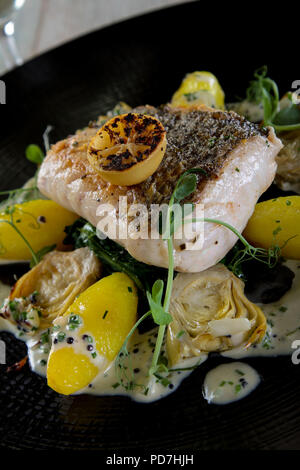 plated fish cod loin main meal Stock Photo - Alamy