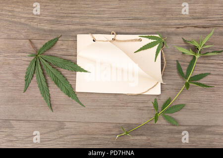 Hemp leaves and flowers with handmade craft notebook on old grunge ...