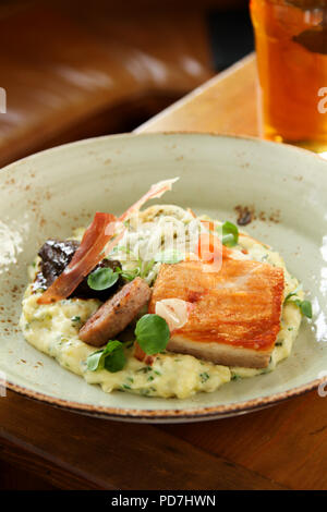 plated pork belly main Stock Photo - Alamy
